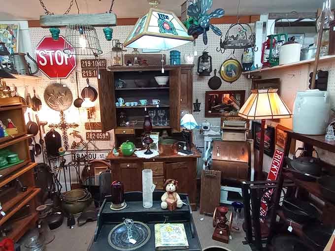 Stop signs, stained glass lamps, cast iron, and crockery, this booth has more personality than most people's living rooms.