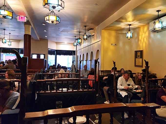 Colorful stained-glass lanterns, dark wooden booths, and a room full of happy people. This is what a dining room is supposed to feel like.