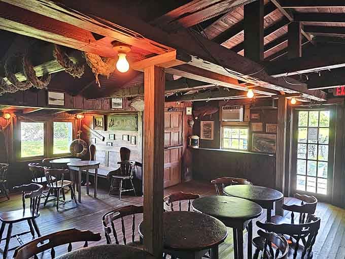 Dark wood, bare bulbs, and decades of stories overhead, this dining room earns every bit of its character.