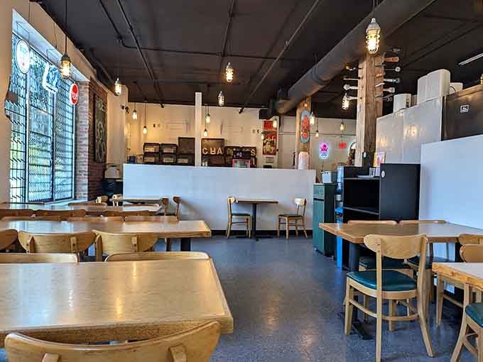 Warm wood, Edison bulbs, and brick walls, this is what a sandwich shop should feel like.