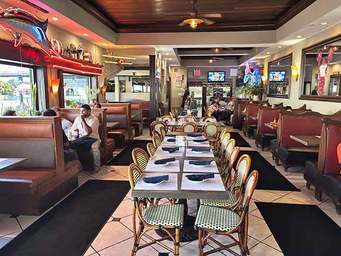 Leather booths, neon glow, and rattan chairs. This room says "stay a while" and means it.