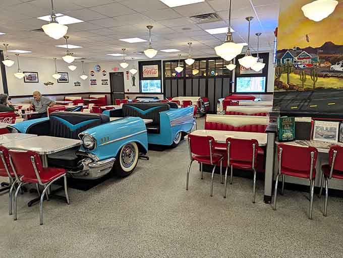 A powder blue 1957 Chevy Bel Air booth sitting in the middle of a dining room. Life is occasionally perfect.