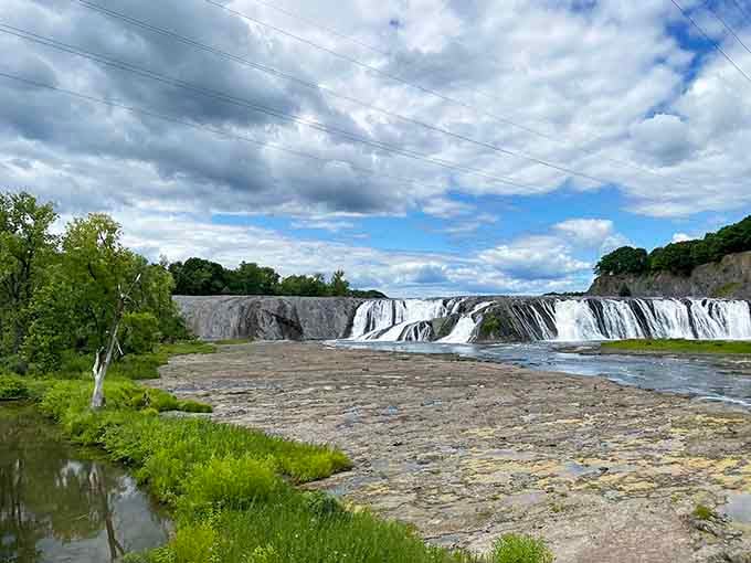 Over a thousand feet of pure waterfall stretching across the horizon like nature's own IMAX screen.