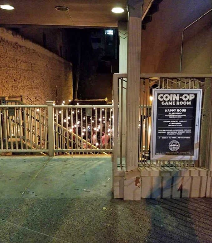 That sign outside says it all: happy hour, free play Sundays, and zero tolerance for anyone under 21.