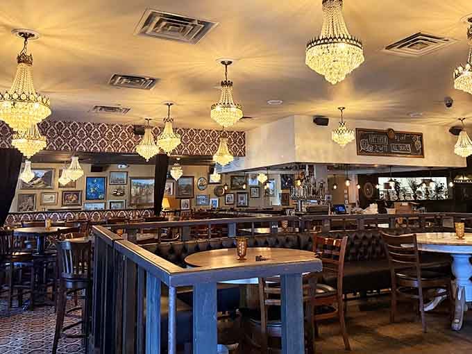 Crystal chandeliers and patterned wallpaper create an atmosphere that's equal parts elegant pub and comfortable neighborhood gathering spot.
