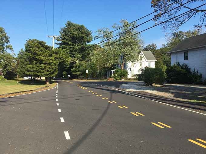 Gentle curves through residential areas where the pace slows and neighbors still wave from their porches.
