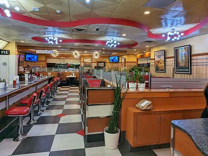 Red vinyl stools, checkered floors, and sputnik lights. This is what a diner is supposed to look like.