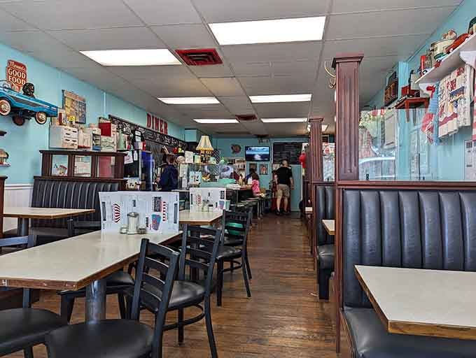Turquoise walls, black vinyl booths, and enough vintage charm to make your grandmother feel right at home.