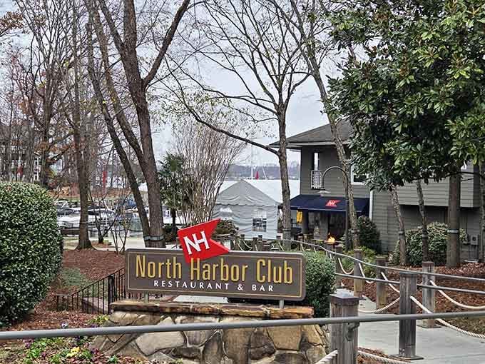 That bold red flag and stone signage at North Harbor Club practically whisper, "Lake views and cold drinks are waiting inside."