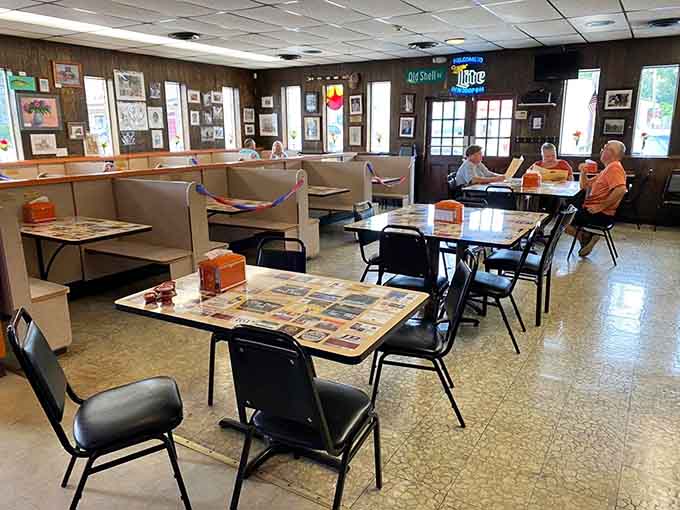 Wood-paneled walls, cozy booths, and photographs everywhere. This room has heard a thousand good conversations.