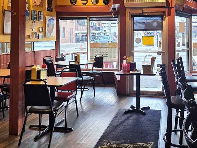 Warm wood tones, mismatched chairs, and condiments on every table, this room means serious business.