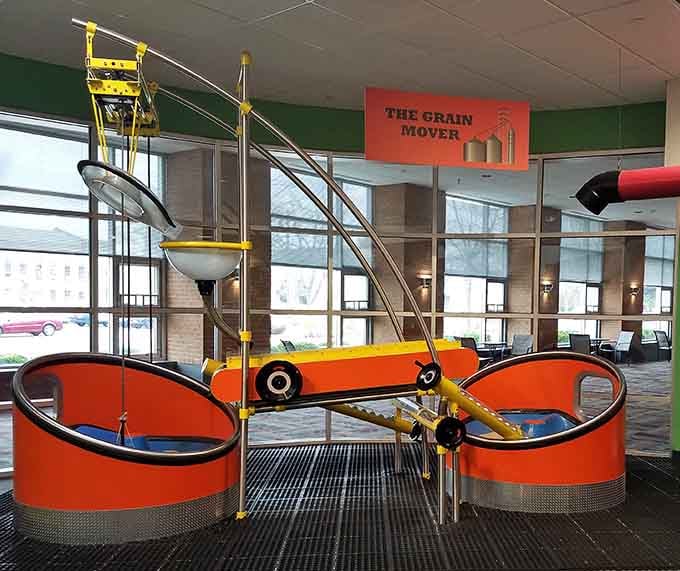 The Grain Mover's bold yellow and orange machinery turns an agricultural lesson into something kids actually want to touch and explore.