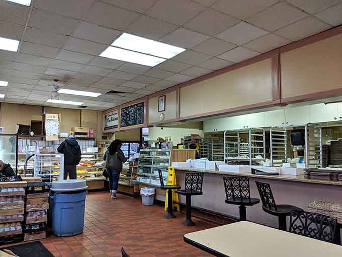 Step inside Dom Bakeries and the warm, sweet smell hits you before the display cases even do.