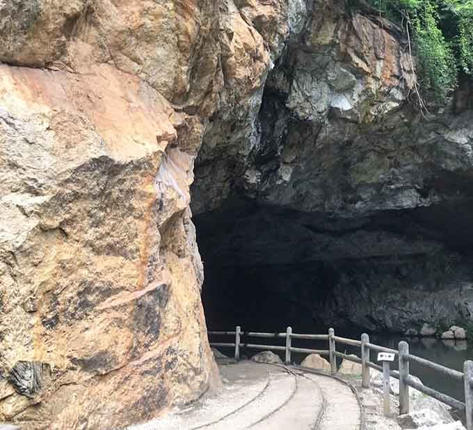 That cave entrance isn't asking you in politely. It's daring you.