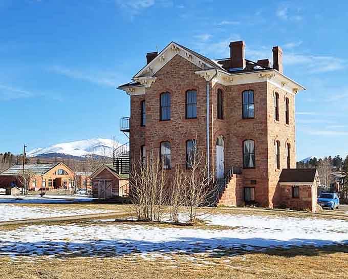 The Park County Courthouse stands proud in winter, proving Victorian architecture ages better than most of us.
