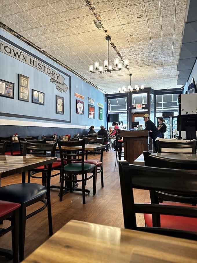 Pressed tin ceilings, warm wood floors, and hometown history on the walls. Pull up a chair.