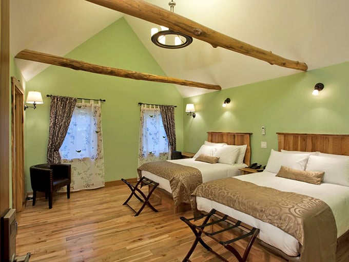 Exposed wooden beams, soft green walls, and beds so inviting you'll negotiate your checkout time twice.