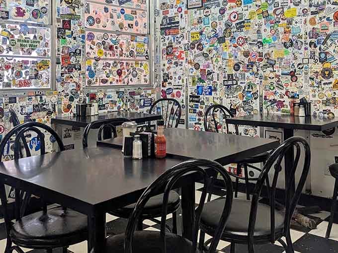 Thousands of stickers, zero pretension. These walls have more stories than your most talkative uncle at Thanksgiving.
