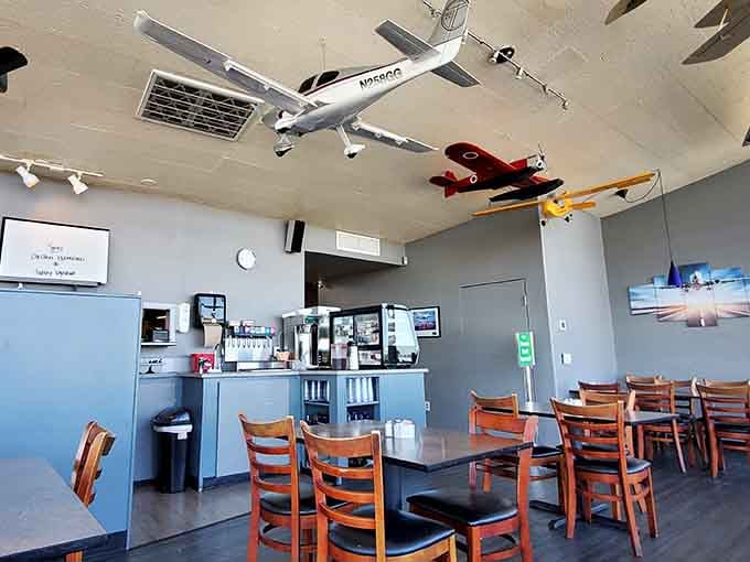 Model planes suspended mid-flight above your table make every meal feel like an adventure at 30,000 feet.
