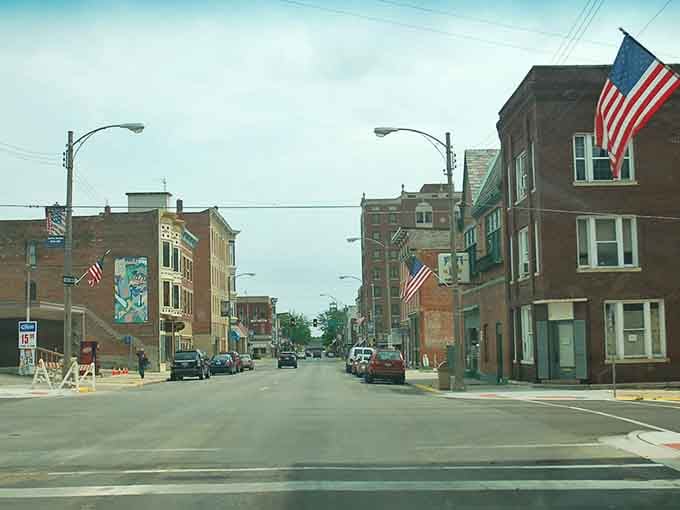 American flags wave proudly above brick buildings that have witnessed generations of Main Street stories and small-town triumphs.