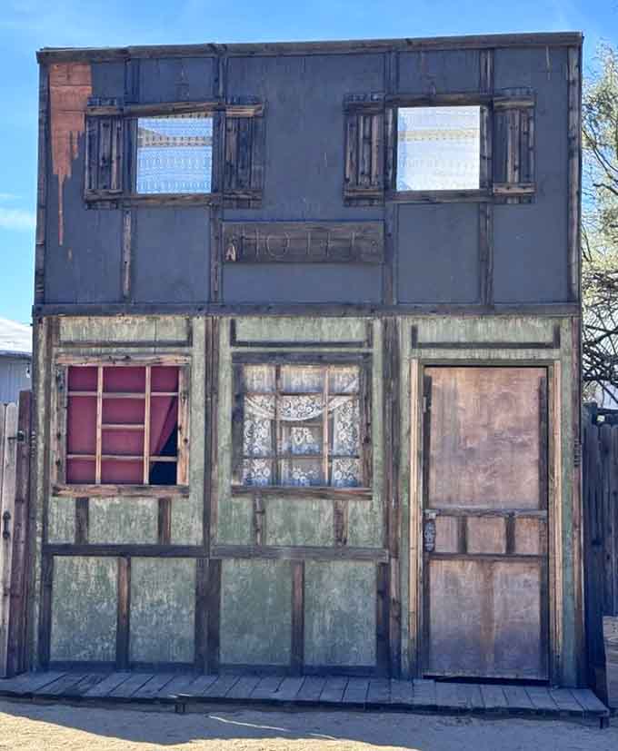 Lace curtains, weathered metal, and a faded hotel sign that whispers stories from another century entirely.