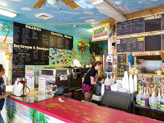 Inside, tropical murals transport you somewhere warmer while the menu boards promise edible adventures you won't forget.