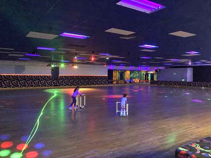 Roller skating under colorful lights, proof that some joys never go out of style.