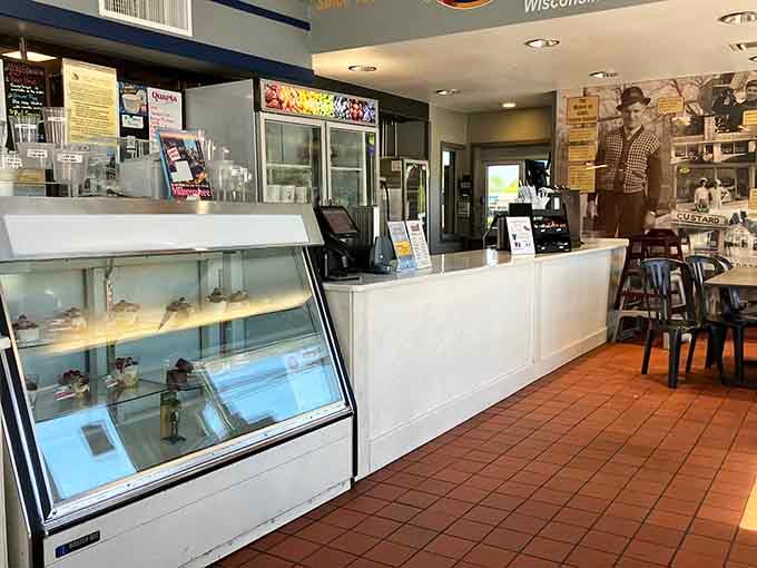 A spotless white counter, a glass display case full of custard creations, and decades of Milwaukee pride on the walls.