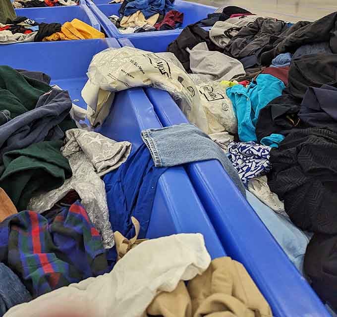 Dig in, friends. These blue bins are basically a lucky dip with a wardrobe jackpot.