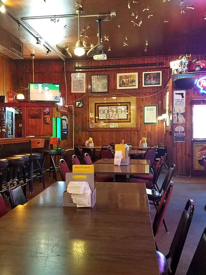 Wood paneling and paper airplanes overhead create an atmosphere that feels like your favorite uncle's rec room.