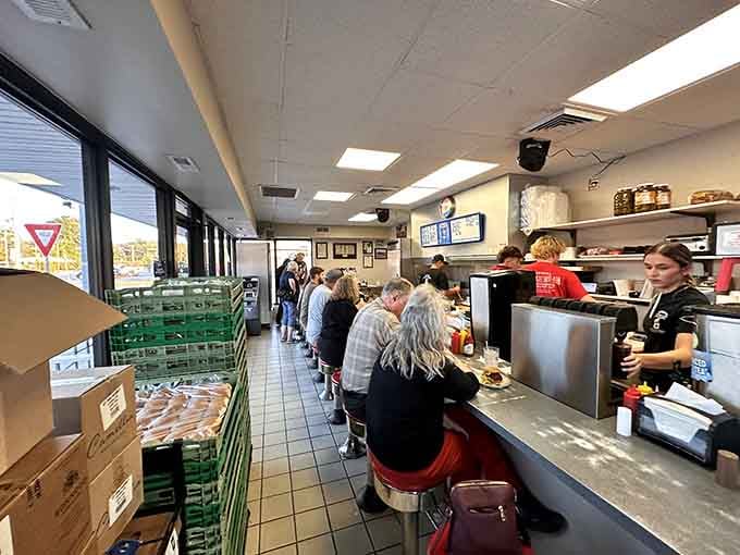 Counter seats, red stools, and a kitchen you can actually watch. This is how diners were meant to be.