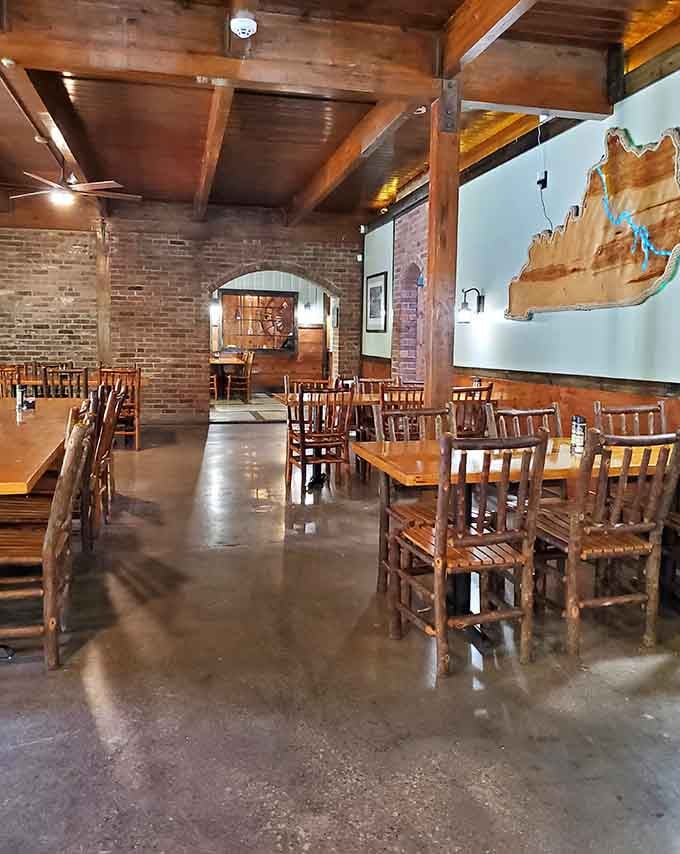 Exposed brick, wooden beams, and a Kentucky cutout on the wall set the stage for serious comfort food.