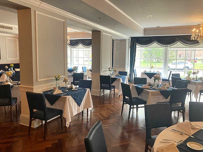 White linens, navy accents, and parquet floors that whisper, "Yes, you absolutely deserve a nice dinner tonight."