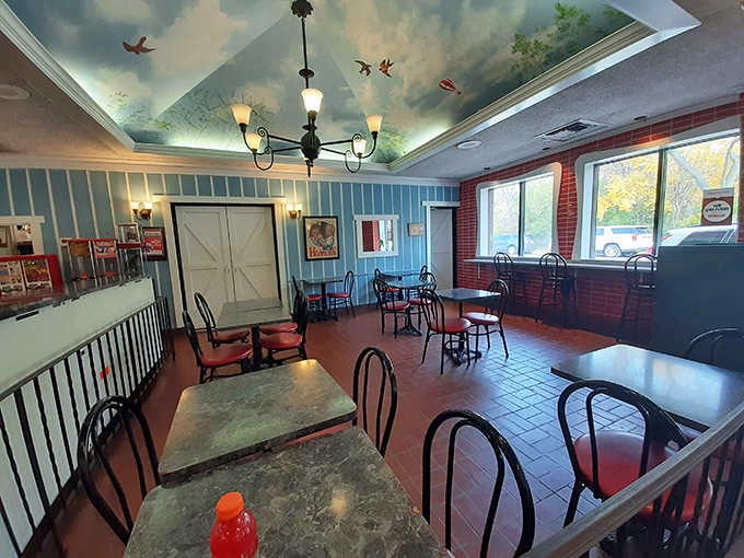 Look up at that painted ceiling and suddenly you're eating ice cream under an open sky. Genius.
