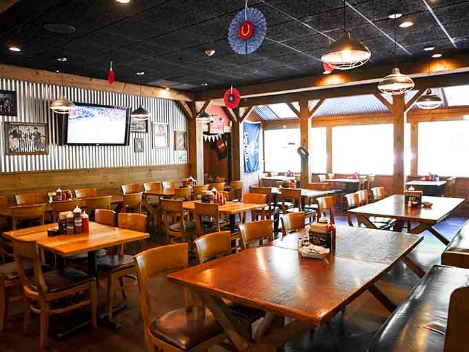 Corrugated metal walls, wooden beams, and sturdy tables built for serious eating. This room means business.