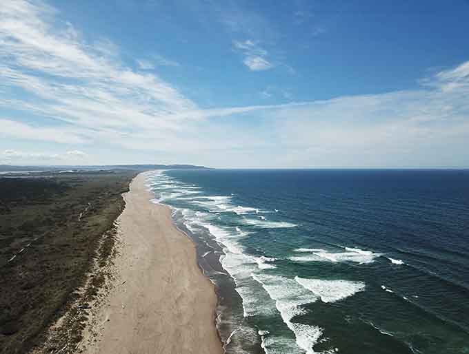 From up here, the coastline looks like nature drew a perfect line between land and sea, just for you.