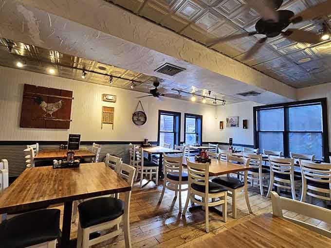 Tin ceilings and warm wood floors create the kind of cozy atmosphere where time slows down deliciously.