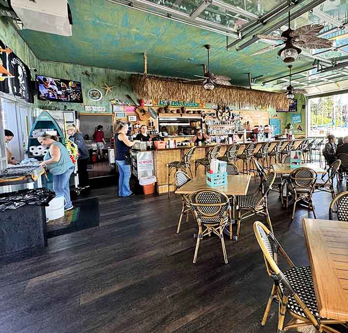 Warm wood floors, palm leaf fans, and a bar that means business. This place knows exactly what it's doing.