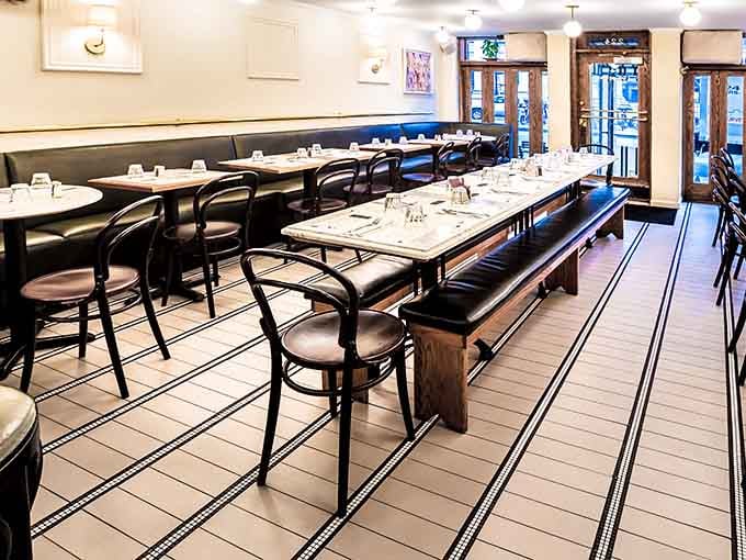 Bentwood chairs, marble tables, and black leather banquettes. This room means serious, delicious business.