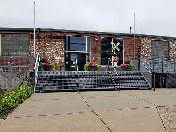 The railroad crossing sign at the entrance isn't just decoration. It's a promise of what's waiting inside.