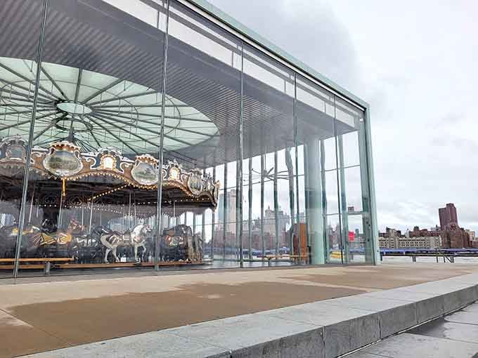 From the outside looking in, Jane's Carousel glows like a snow globe someone forgot to shake.