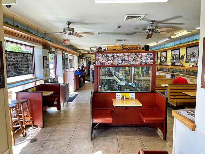 Red vinyl booths and model trains overhead: where nostalgia meets your appetite in the best possible way.