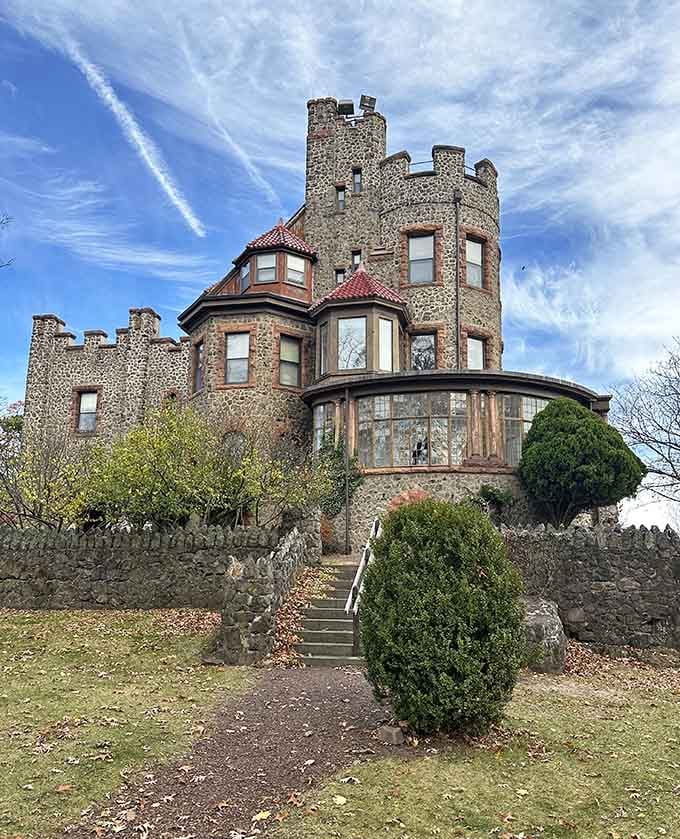Those battlements aren't decorating a theme park. This is genuine stone craftsmanship rising proudly above the Essex County hills.