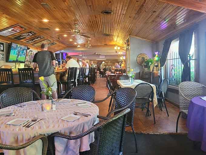 Warm pine ceilings, ceiling fans spinning lazily, and tables set with care. This room means business.