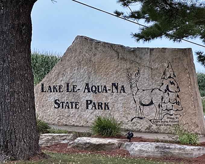 That hand-carved stone sign, complete with a proud deer, is basically nature's way of saying "you made the right turn."