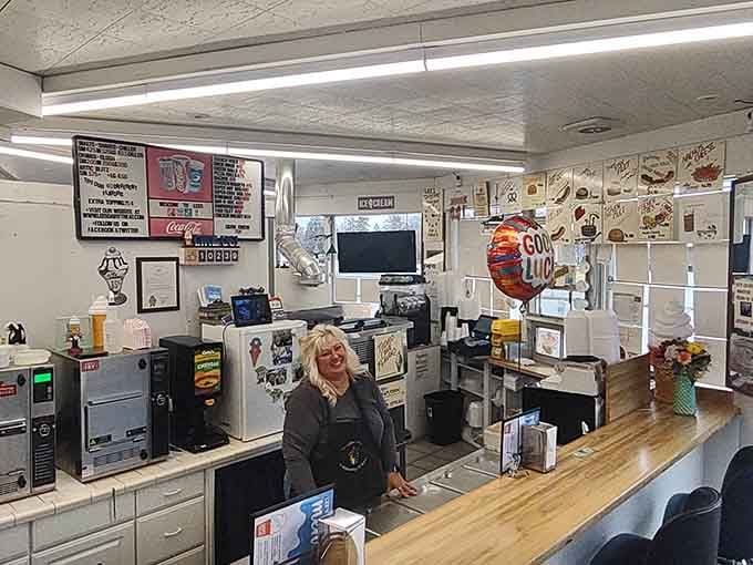 The kind of smile behind this counter tells you everything, this place runs on good people and great ice cream.