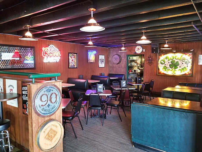 Wood-paneled walls, neon beer signs, and mismatched chairs: this is what a proper dive bar looks like inside.