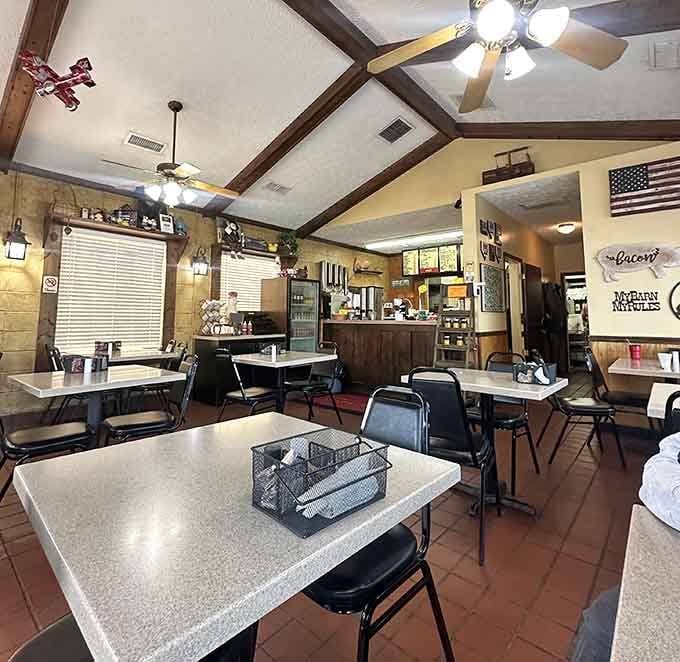 Exposed beams and ceiling fans create that perfect country kitchen atmosphere where breakfast tastes better somehow.