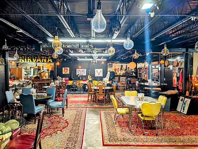 Dark ceilings, oversized bulbs, colorful rugs, and a Nirvana sign. This isn't your average antique mall, folks.