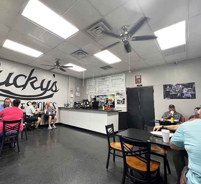 Ceiling fans, simple tables, and the Lucky's logo on the wall. Comfort doesn't need to be complicated.